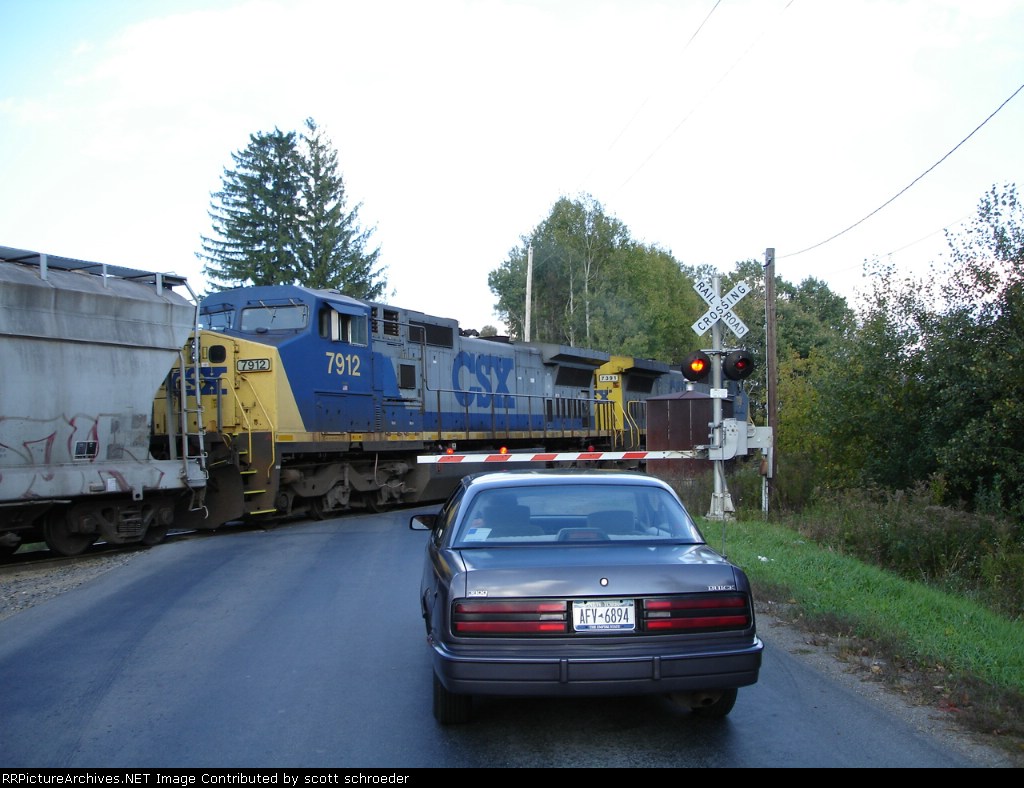 CSX 7912 & CSX 7391 cross over Peck Rd. headed for the Detector NB
